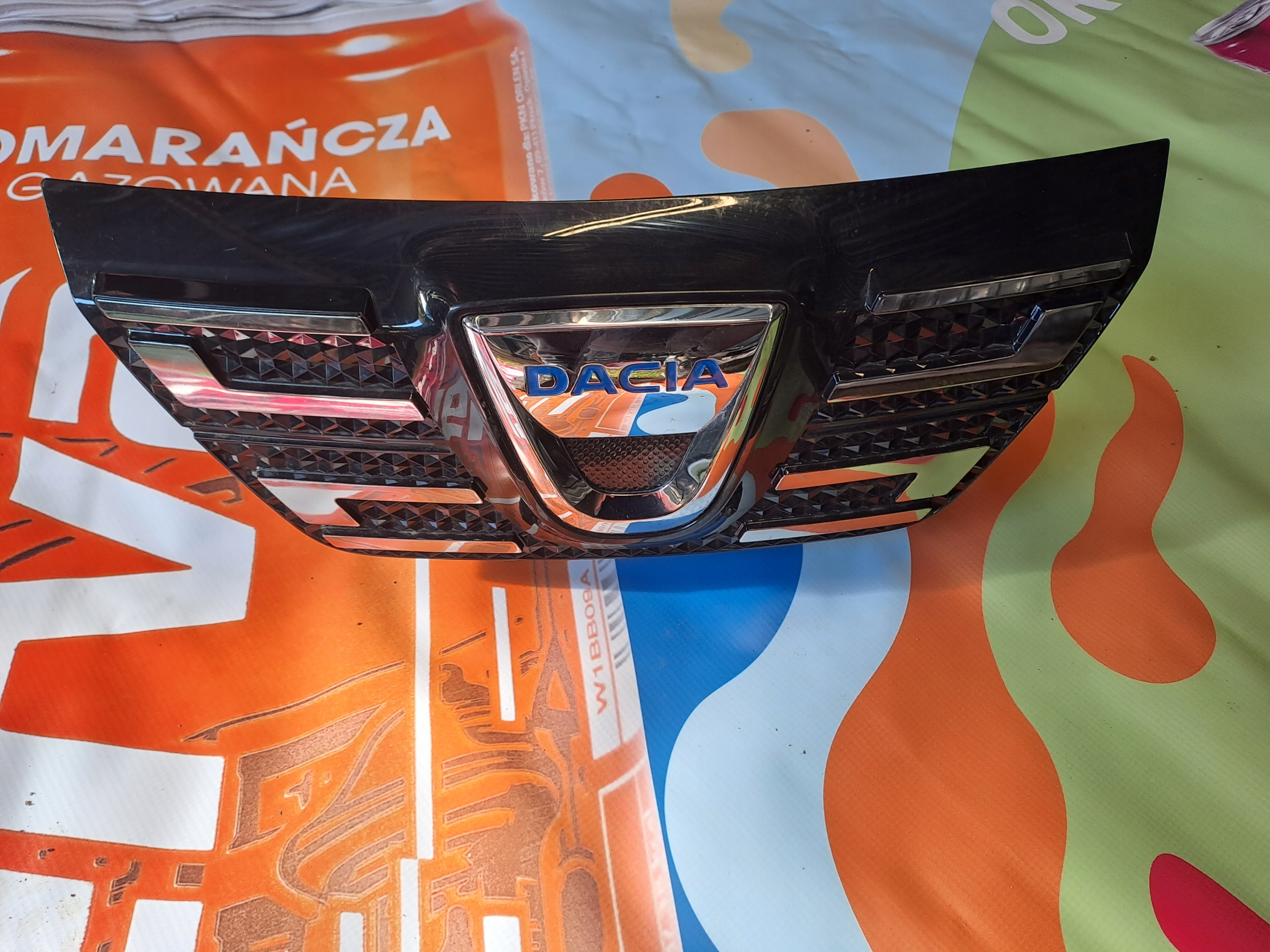 Dacia Spring grill atrapa zderzaka 623105273R - porównaj ceny - Allegro.pl