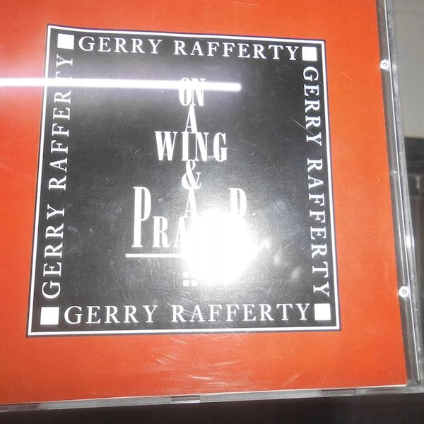 On A Wing & A Prayer Gerry Rafferty CD • Cena, Opinie - Allegro
