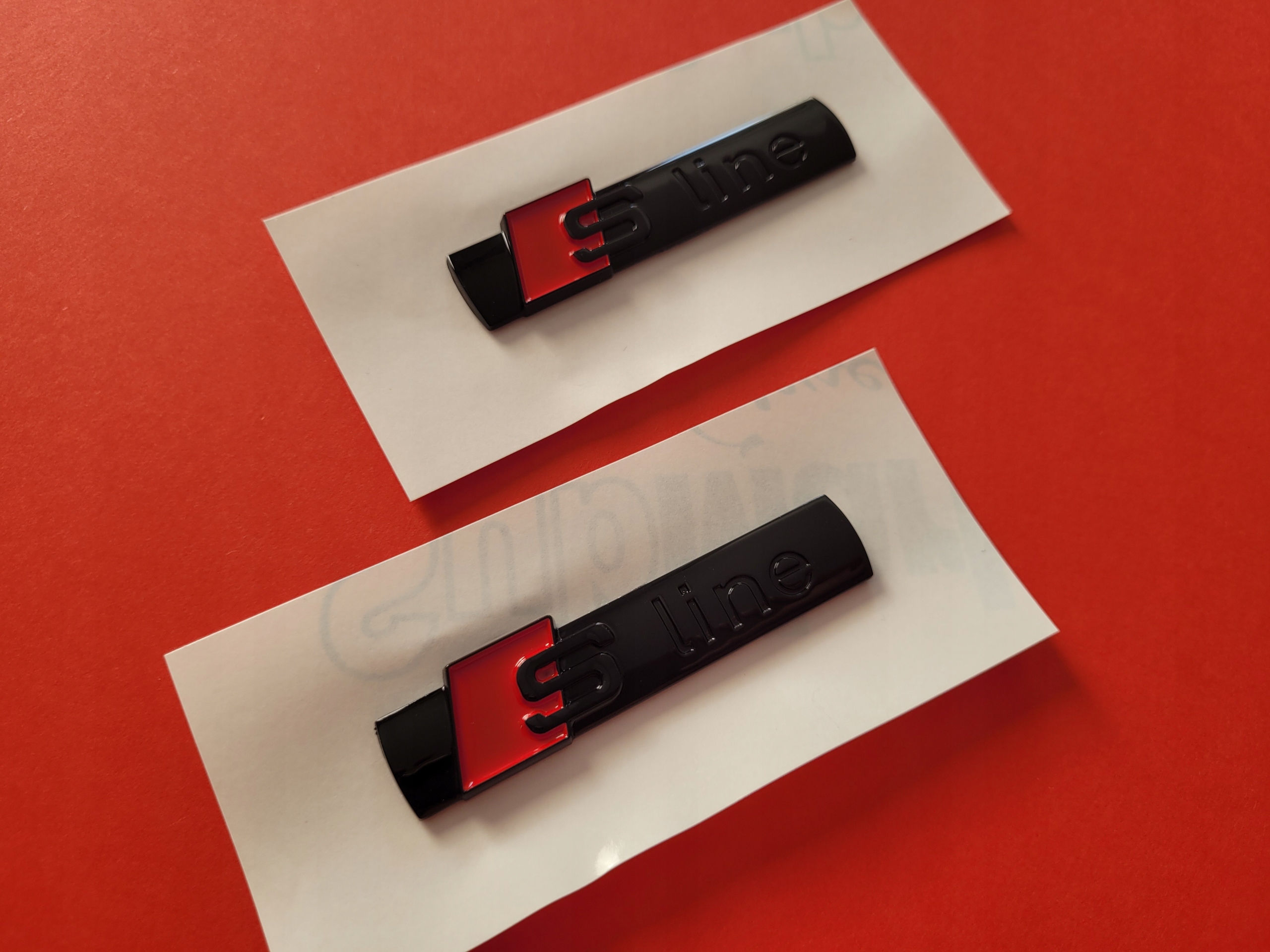 Emb_sline_do_audi_black_glossy_blotnik_70mm_komplet - Емблеми S-Line ...