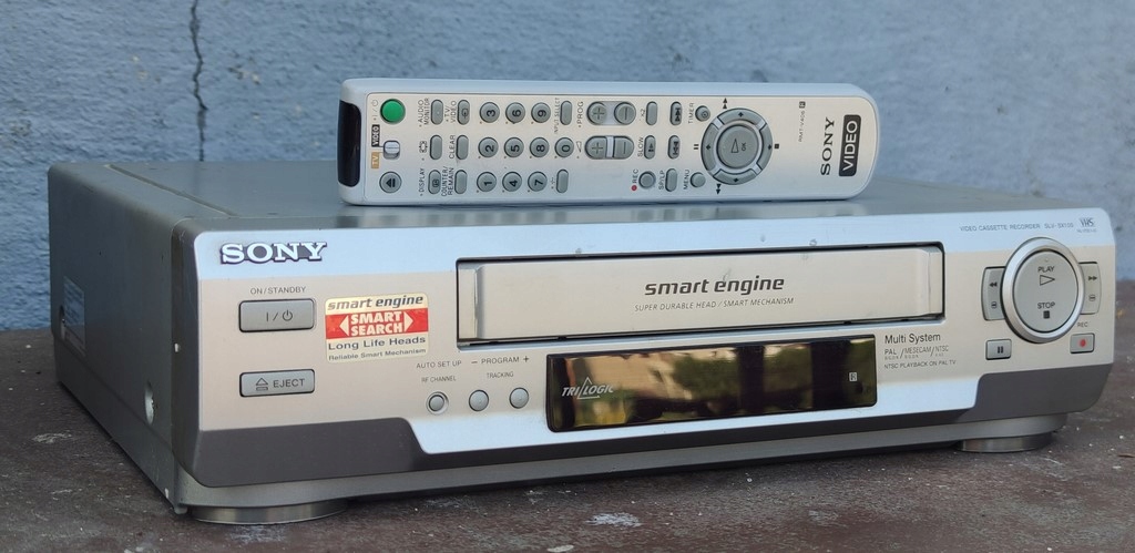 SONY SLV-SX100 VHS LP/SP/SmartLink/NTSC pilot - 13916644063 - oficjalne archiwum Allegro