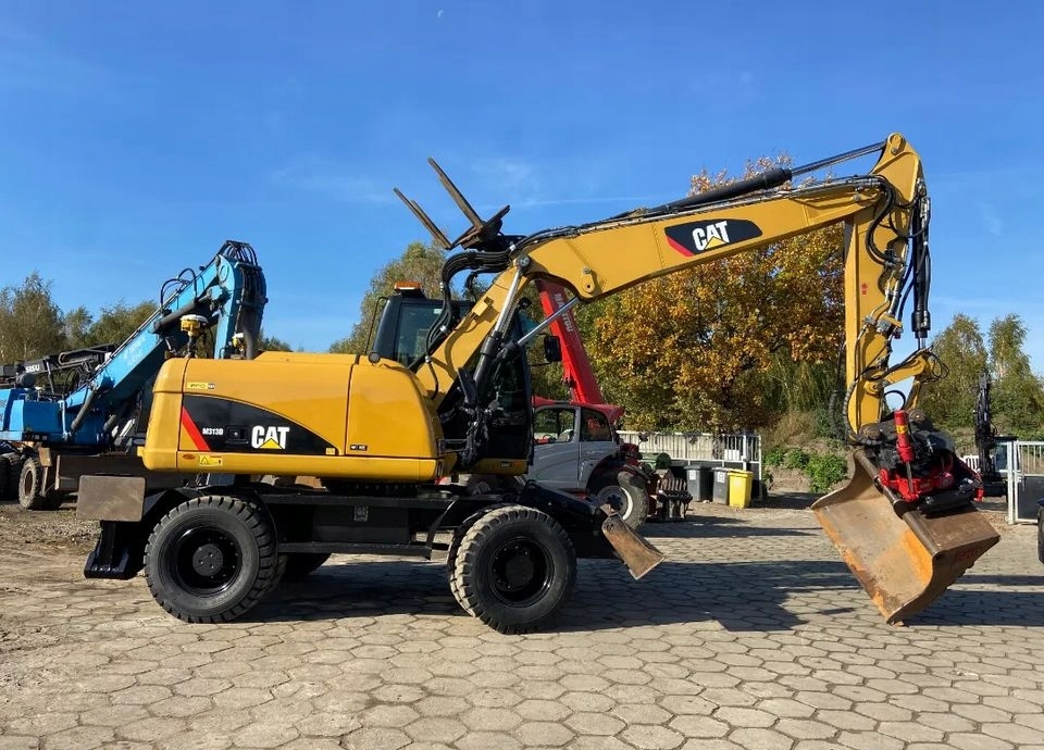 Caterpillar M313D - 12758892335 - oficjalne archiwum Allegro