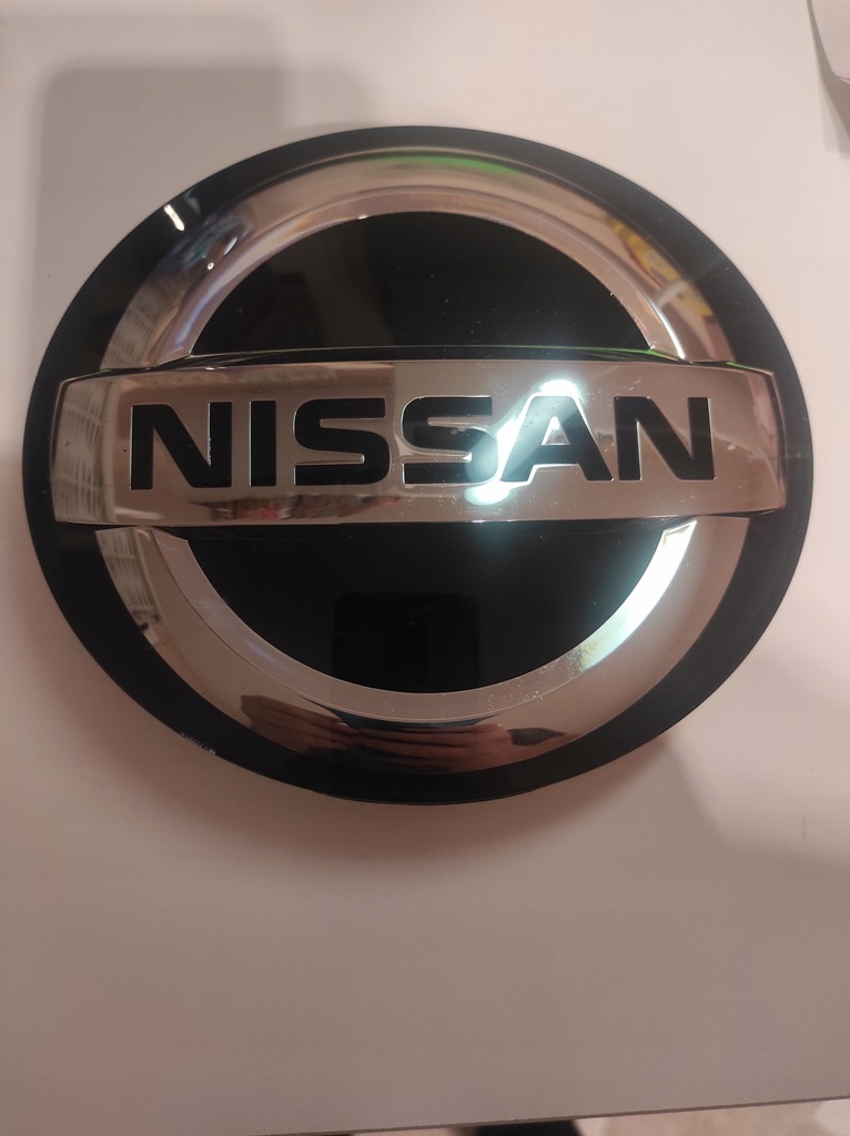 Znaczek emblemat logo pod radar grill przód Nissan Qashqai 2 J11 17 ...